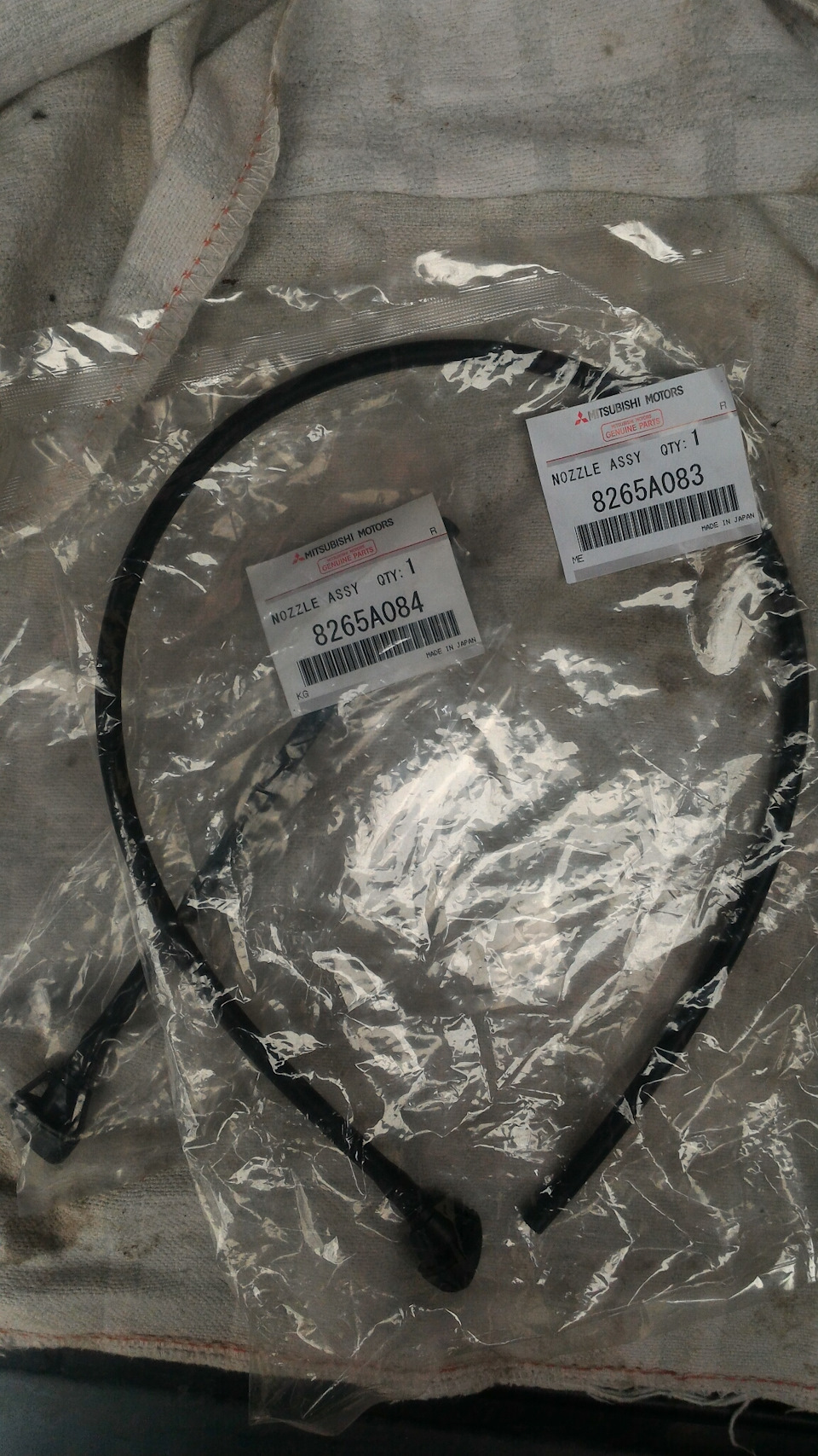 8265A083 Форсунка омывателя Mitsubishi | Запчасти на DRIVE2